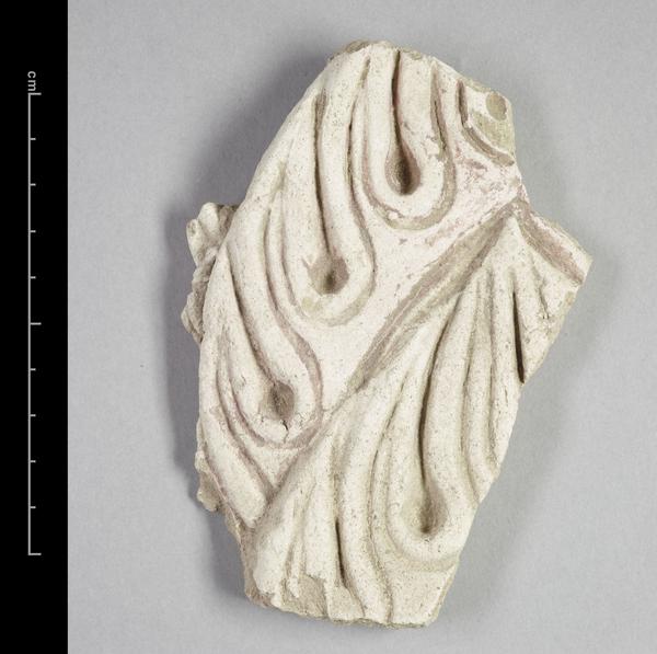 Collection object "MAS.415" • Fragment of a vesica made of stucco ...