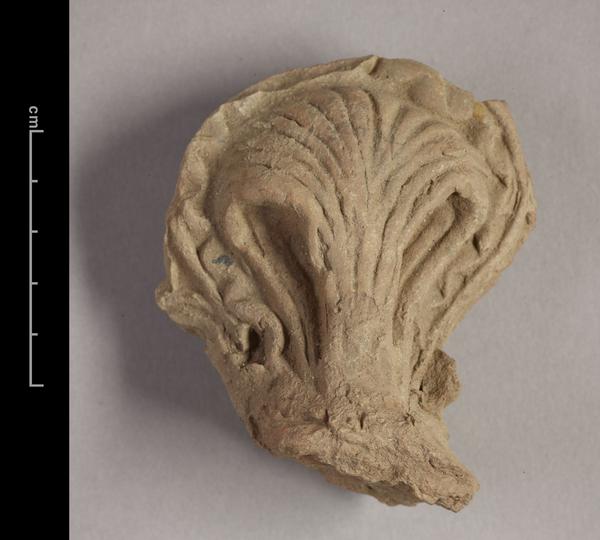 Collection object "MAS.308" • Hair knot made of yellowish brown clay ...